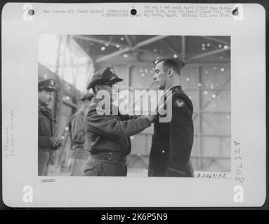 Major General Lewis H. Brereton presenting T/Sgt. Albert S. Fisher ...