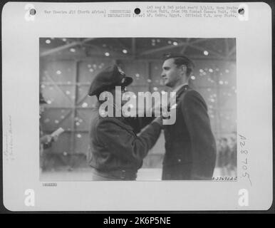 Major General Lewis H. Brereton presenting M/Sgt. Frederick W ...