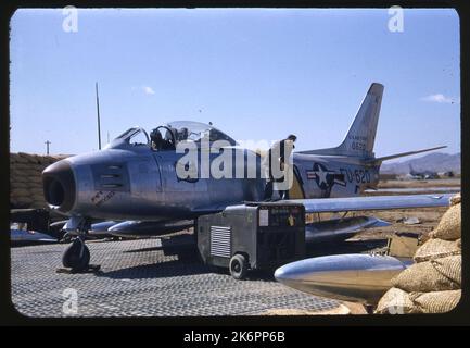 Technician standing next to electrical unit Stock Photo - Alamy