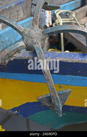 Iron anchor at ancient ship traditional wooden dhow in Kuwait port ...