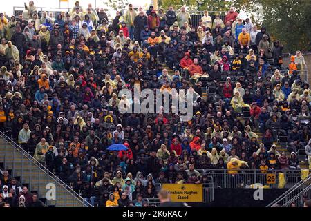Fans wearing ponchos during the Premier League match at Molineux ...