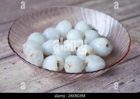 Fresh red lychee isolated close up on white Stock Photo - Alamy