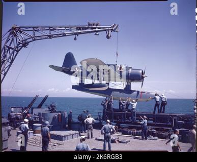 OS2U scout plane lowered to its cradle aboard the USS Missouri to be ...