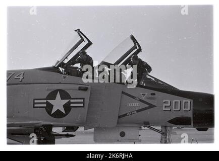 The pilot of a Fighter Squadron 74 (VF-74) F-14B Tomcat aircraft waits for instructions on the ...