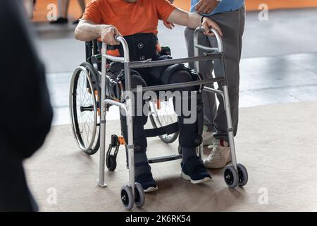 Boy with Mobility Problems in Lower Limbs in Upright Posture Walking ...