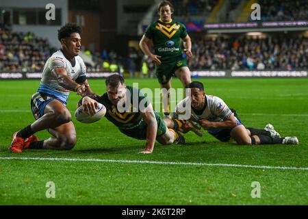 Angus Crichton of Australia goes over for a try to make it 0-12 during ...