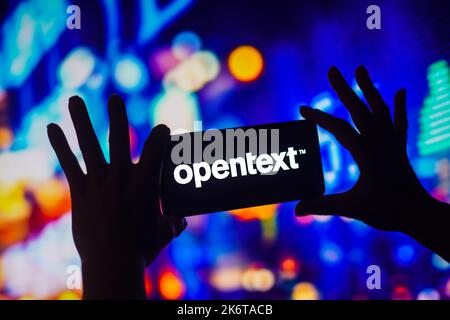 In this photo illustration, the OpenText Corporation logo is displayed ...