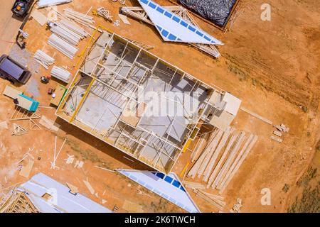 Aerial view the construction wood framing beams of a new house under construction Stock Photo ...
