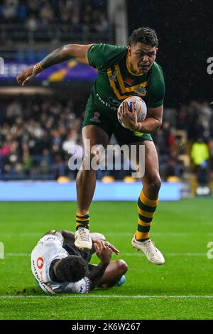 Latrell Mitchell of Australia is tackled by Kevin Naiqama of Fiji ...
