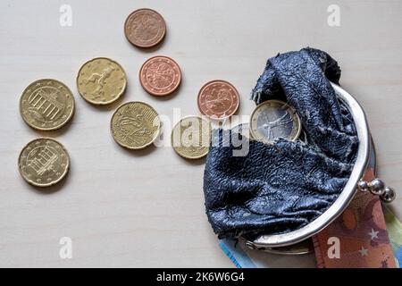 Germany. 15th Oct, 2022. In this photo illustration, Coins spill out of ...