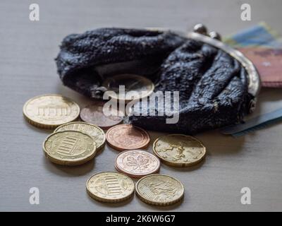 Germany. 15th Oct, 2022. In this photo illustration, Coins spill out of ...