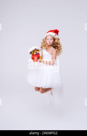Photo of dreamy excited girl wear xmas green pullover embracing gift ...