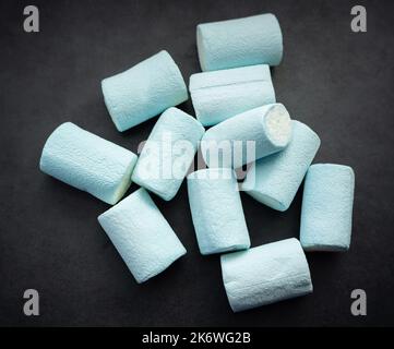 Blue marshmallows on dark background Stock Photo - Alamy