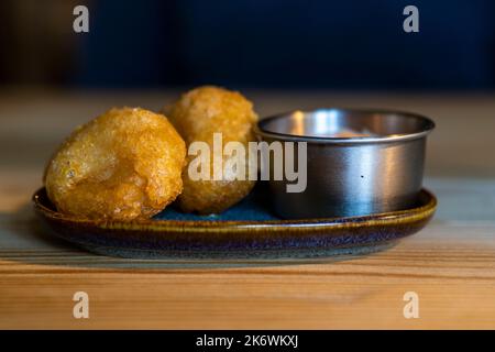 Scallop fritters with a specy dip. Tasty entree served at THe Bell at ...