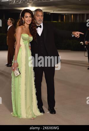 Amal Clooney and George Clooney walking the red carpet at the Second ...