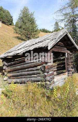 an old little crooked hut in the alps Stock Photo - Alamy