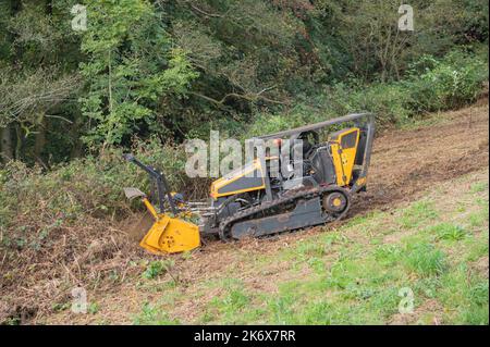 Robocut remotely controlled tracked mower cutting bramble Stock Photo ...
