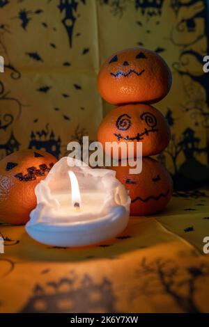 3 Clementines painted like a halloween pimpkin, happy halloween Stock ...