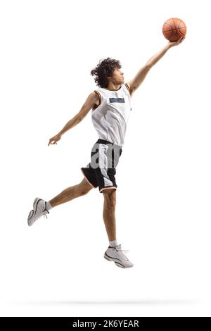 Basketball player performing a layup isolated on white background Stock ...