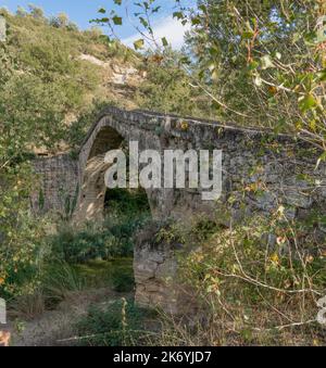 a medieval era pointed arch stone foot bridge in Spain Stock Photo - Alamy