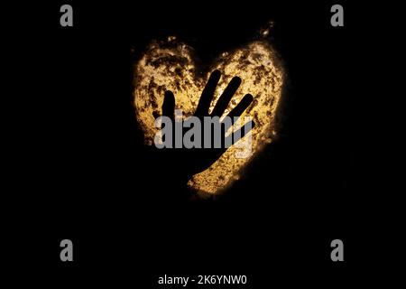 silhouette of woman hand on lighten heart symbol Stock Photo - Alamy
