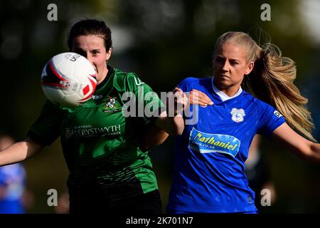 Rhianne Oakley of Cardiff City Women FC is tackled by Rebecca Mathias ...