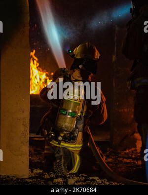 Royal Saudi Air Force firefighters ready their truck’s fire hose for ...