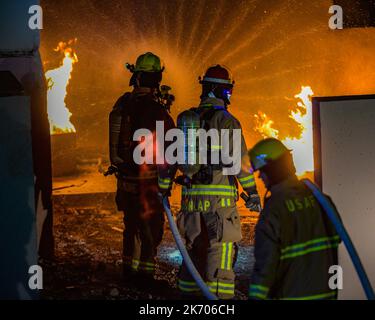 Royal Saudi Air Force firefighters ready their truck’s fire hose for ...