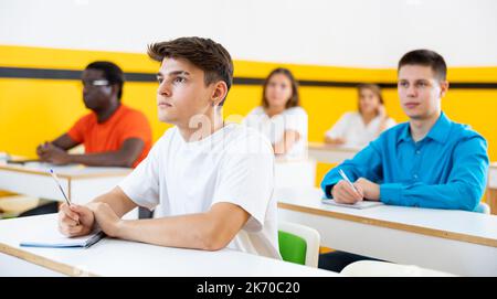 Man attending lecture in taxi training school Stock Photo - Alamy
