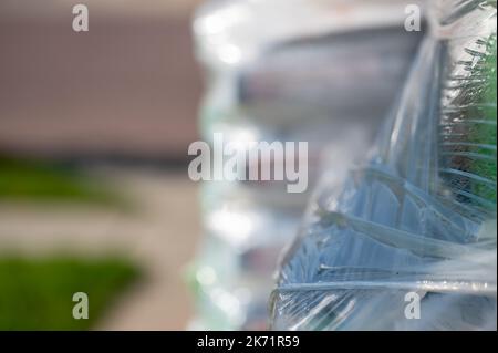 Selective focus on cellophane shrink wrap on pallets of goods for ...