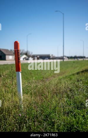 Warning post for underground fiber optic cables in Virginia, USA Stock ...