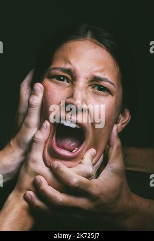 Somebody help me. hands grabbing a young womans neck against a dark ...