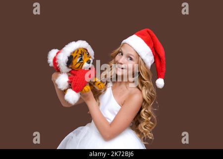 Photo of dreamy excited girl wear xmas green pullover embracing gift ...