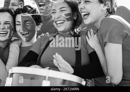 Multiracial sport fans screaming while supporting their team - Football ...