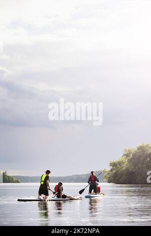 Mother and Son Stand Up Paddling Together Having Fun in the Ocean Stock ...