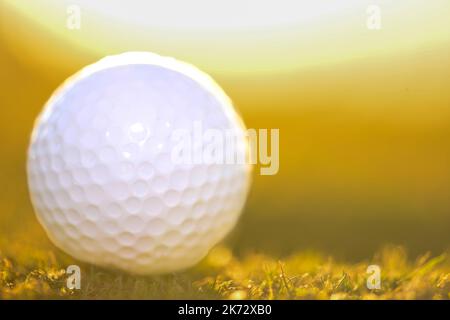 golf course background Golf balls on artificial grass with blur ...