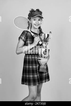 Teenager school girl with award winner trophy. Child hold books with ...