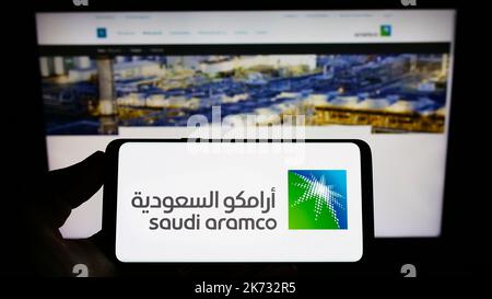 Saudi Aramco company logo in front of Saudi Arabia flag. December 5 ...