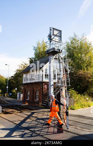 British railway signal box and level crossing gates at Bedale in the ...