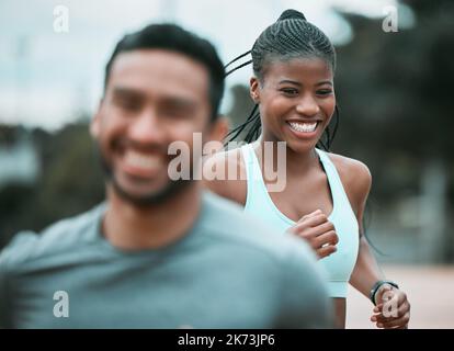 Beat you to the finish line. two friends running together Stock Photo ...