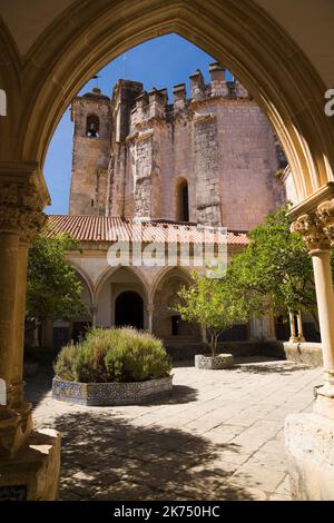 Inner courtyard at the Convent of Christ through silhouetted arch ...