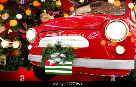 New Year's red car with the flag of Bashkortostan against the backdrop ...