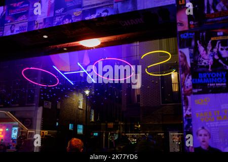 Atmospheric and illuminating neon Soho lettered sign at night time in ...