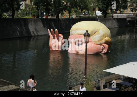 The installation "Everything is fine" depicting the half submerged head ...