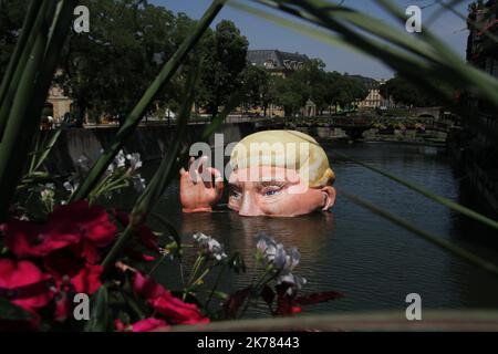 The installation "Everything is fine" depicting the half submerged head ...