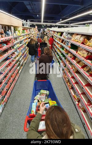 Panic-buying shoppers leave supermarket's shelves empty Stock Photo - Alamy