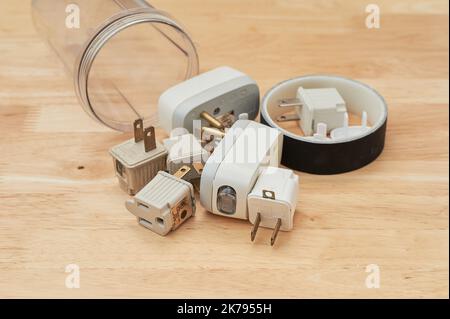 Electrical tape, grounding plugs and circuit interrupters are lying on ...