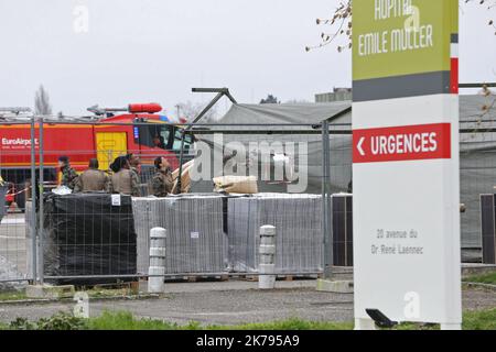 Soldiers are installing a military field hospital near the Emile Muller ...