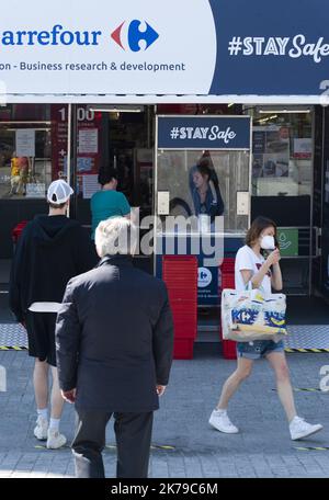 The Carrefour brand is testing a disinfection unit at the entrance to a ...