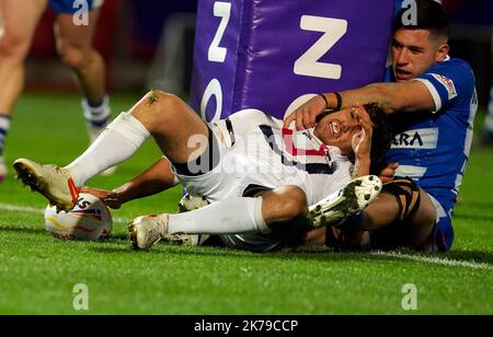 France’s Arthur Mourgue scores a try past Greece’s Alrix Da Costa ...